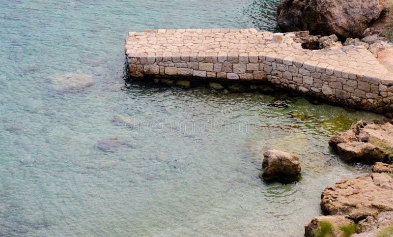 Ancient Stone Pontoon at Turquoise Clear Water Sea Shore Stock Image ...