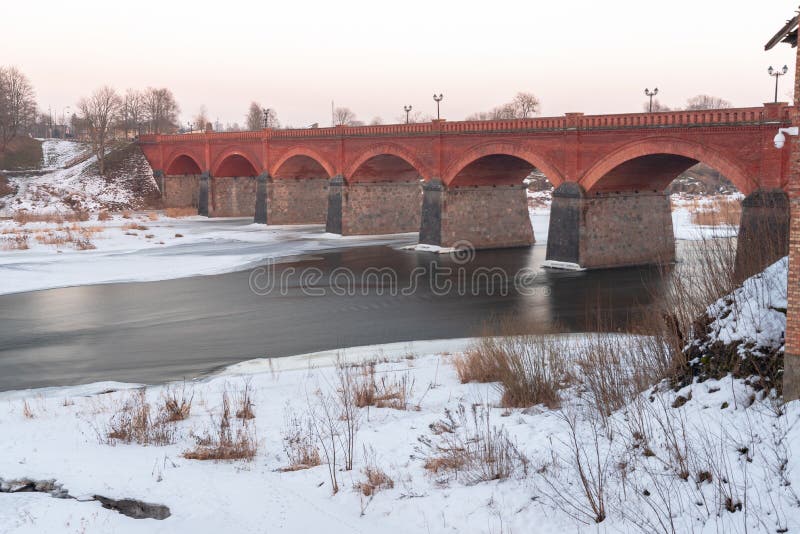 An Ancient Stone and Red Brick Bridge Over the River Stock Image ...
