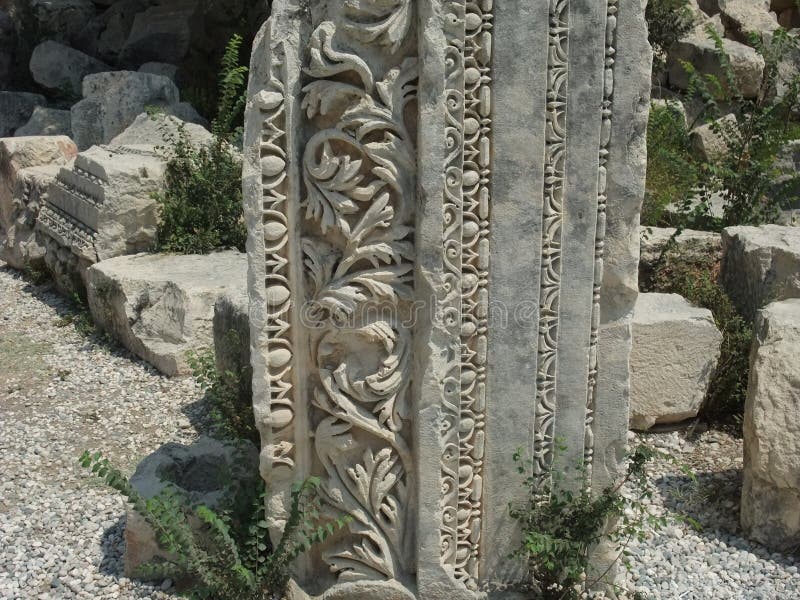 Ancient Stone Ruins with Decorative Carved Elements and Floral Motifs ...