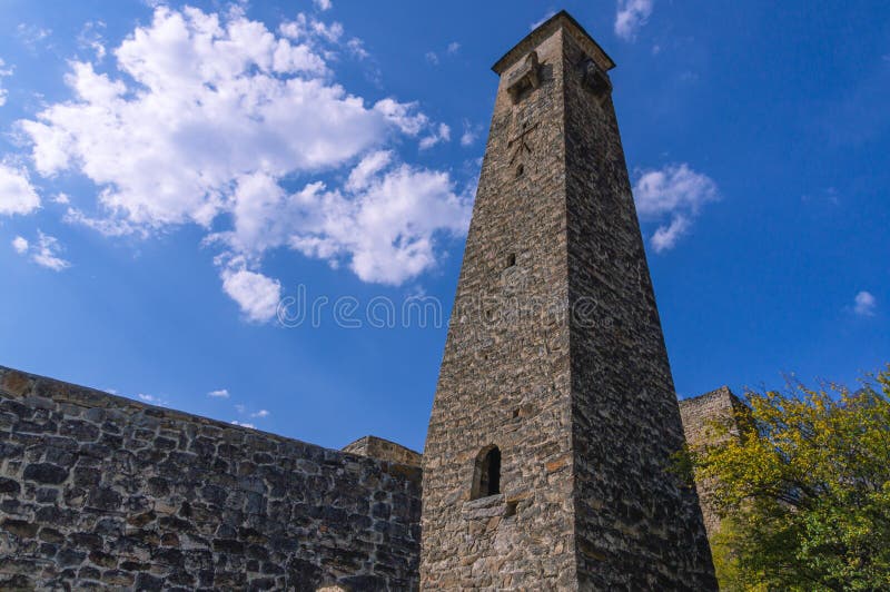 An Ancient Stone Tower with a Religious Symbol in the Form of a Man ...