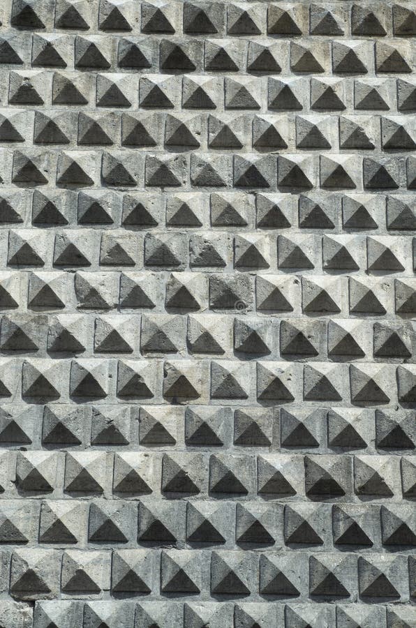 Ancient Stone Wall with Decorative Relief Pyramids Closeup Stock Photo ...