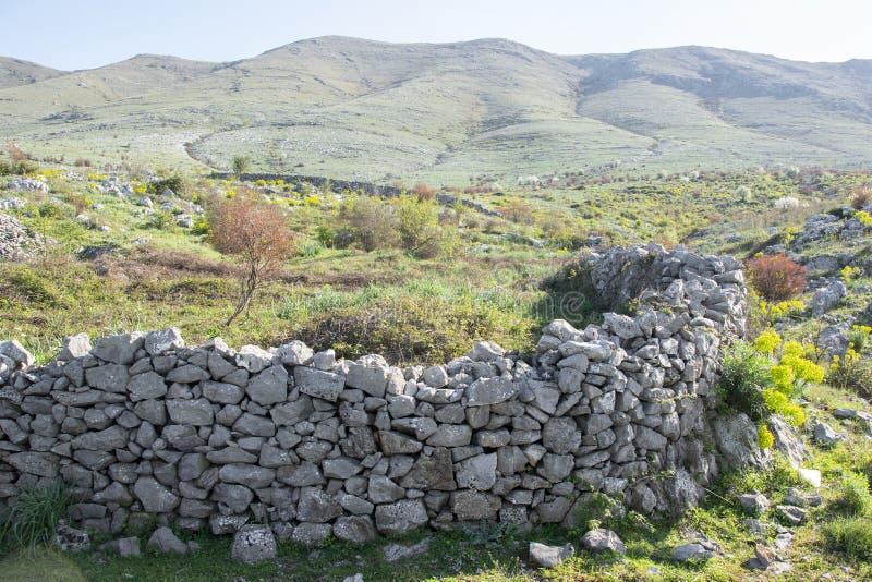 Ancient Stone Wall in the Field Under the Mountain Stock Photo - Image ...