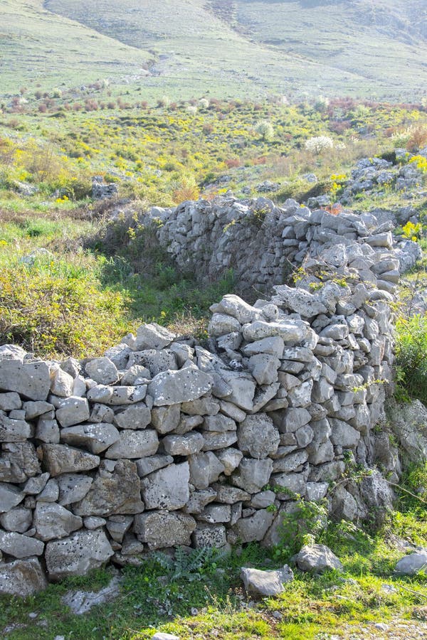 Ancient Stone Wall in the Field Under the Mountain Stock Photo - Image ...