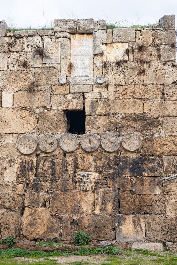 Ancient Stone Wall with Historical Engravings and Weathered ...