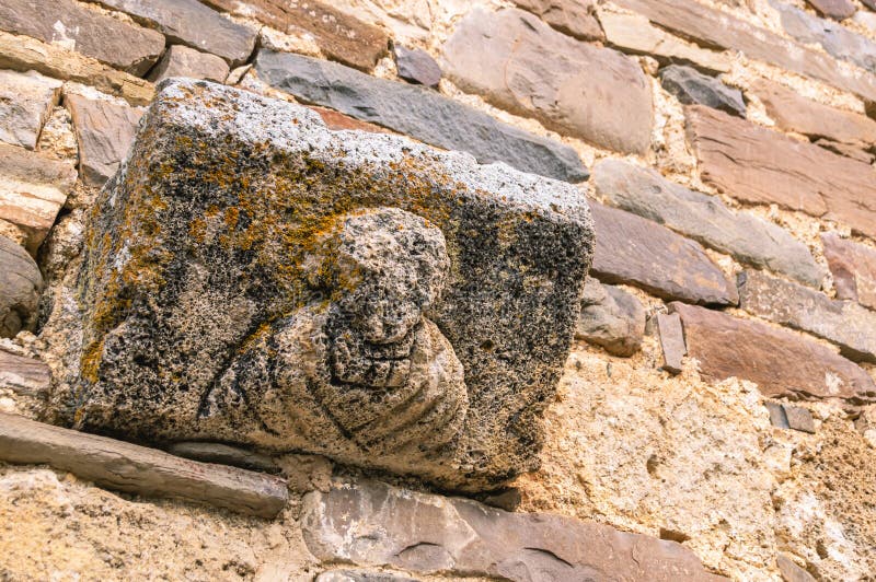 An Ancient Stone Wall with Images that Have Undergone Devastating ...