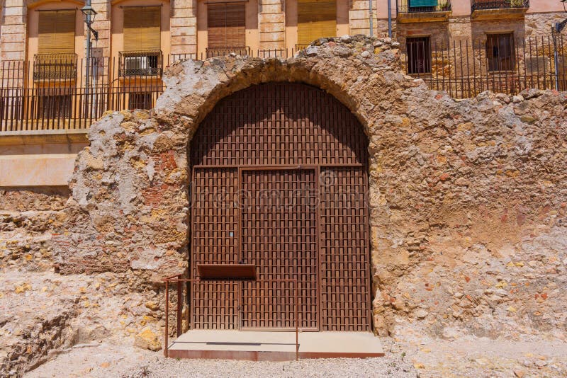 Ancient Stone Wall with Metal Gate in Tarragona Stock Image - Image of ...