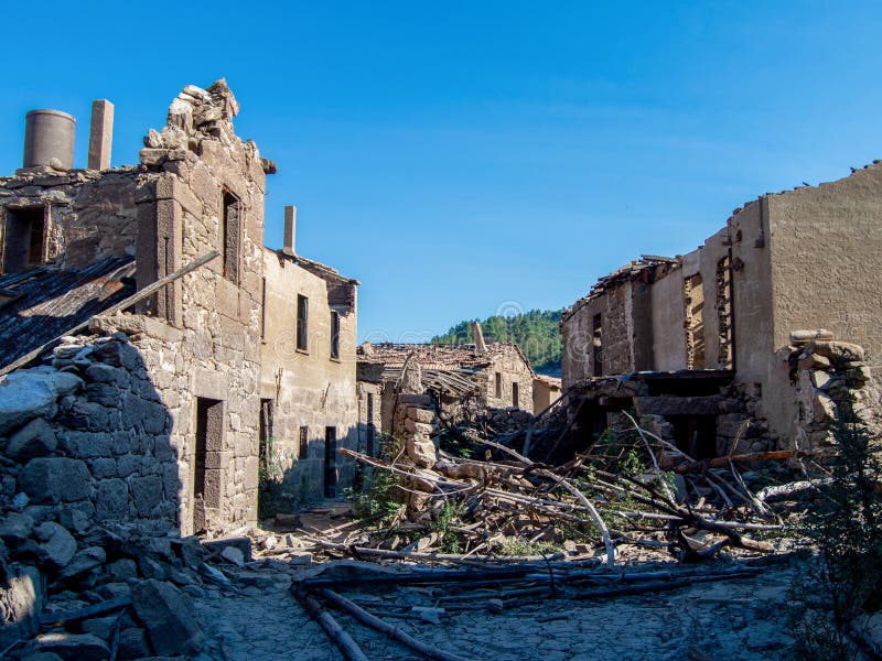 A Very Old Building Sitting in the Middle of a Dirt Field Stock Photo ...