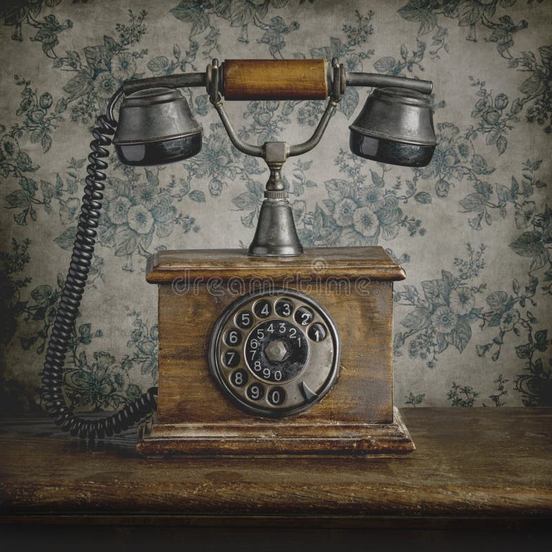 Ancient Vintage Phone on a Table with Retro Wallpaper. Stock Image ...