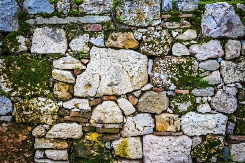 Ancient Wall Made of Natural Rocks with Plants between Blocks Stock ...