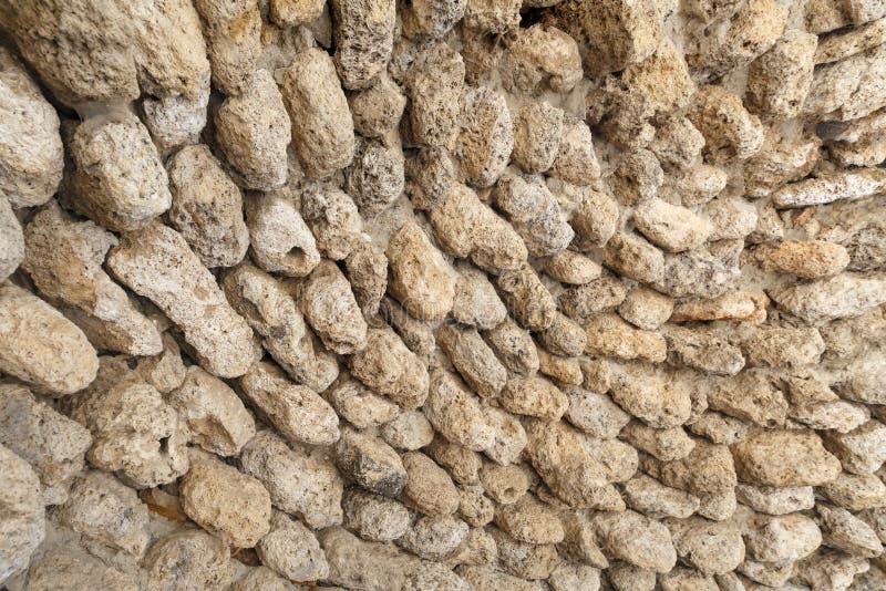 Ancient Wall Made of Round Stones As a Background or Backdrop Stock ...
