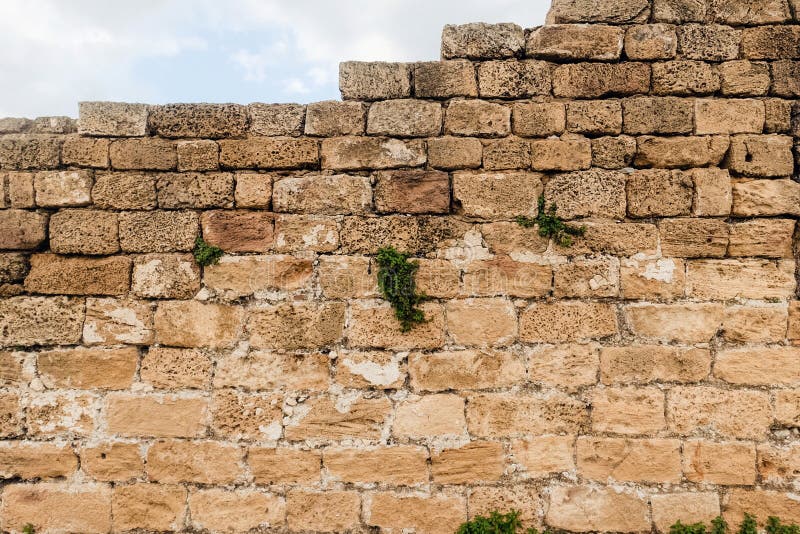 An Ancient Wall Made of Stone Bricks. Caesarea Stock Image - Image of ...