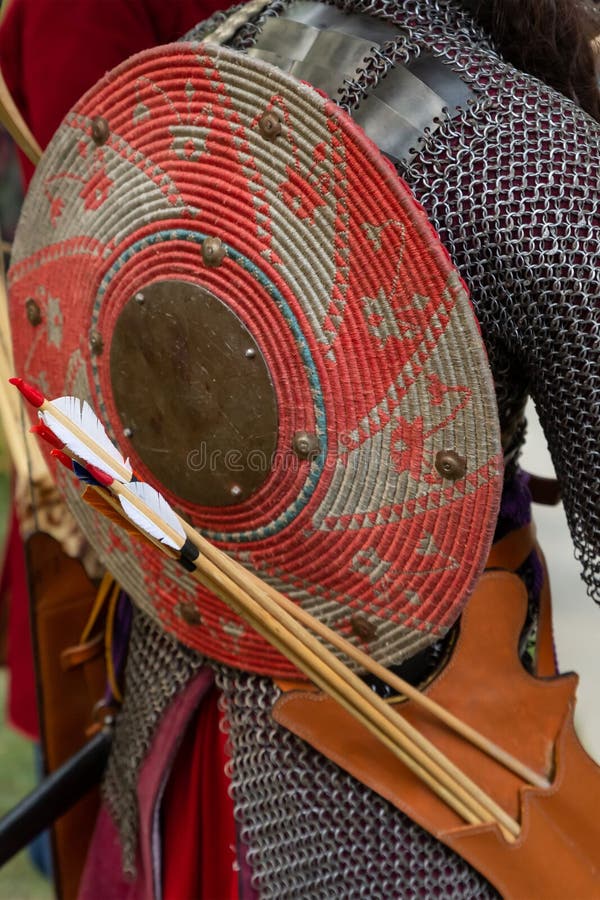Ancient Warrior in Protective Iron Mail with a Wooden Shield and a ...