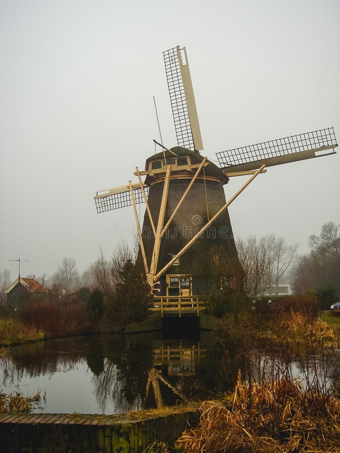 Ancient Windmill on the Shore of a Lake. Stock Photo - Image of ...
