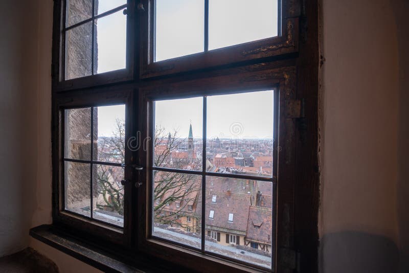 An Ancient Window Overlooking the Tiled Roofs of Nuremberg, Germany ...