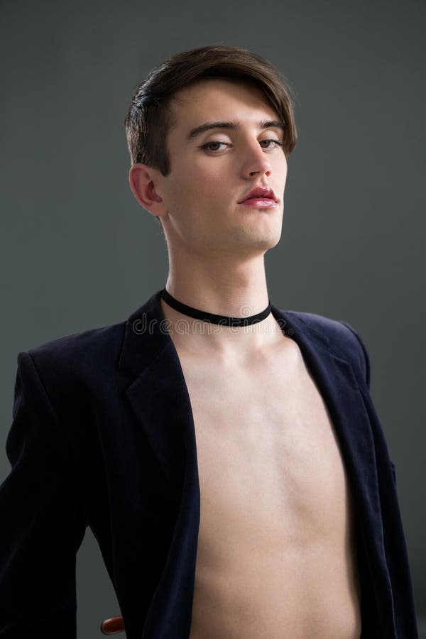 Androgynous Man in Blazer Posing Against Green Background Stock Image ...