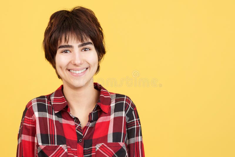 Androgynous Person Smiling while Looking at Camera Stock Photo - Image ...