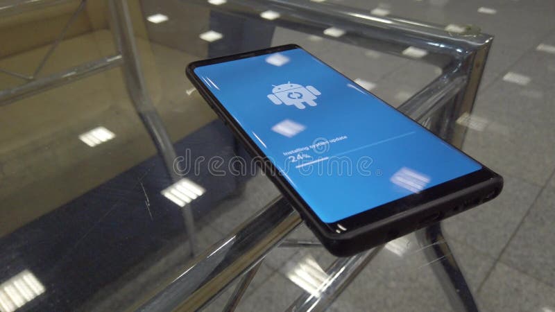 Android Robot Logo Icon on the Smart Phone Screen during Update ...