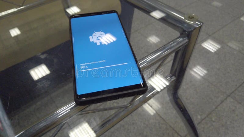 Android Robot Logo Icon on the Smart Phone Screen during Update ...