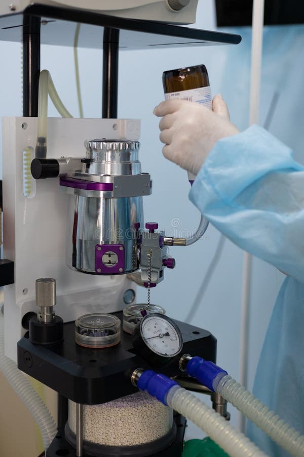 An Anesthesiologist Pouring Anesthesia into a Gas Machine in the ...