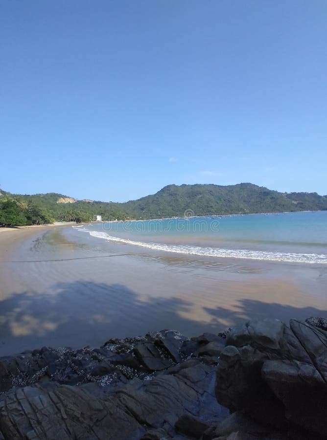 Angel Beach blue mountain stock image. Image of beach - 264047045