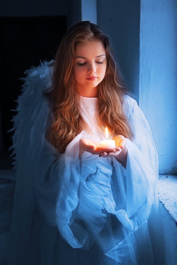 Angel with a candle stock image. Image of cherub, candlelight - 21232183