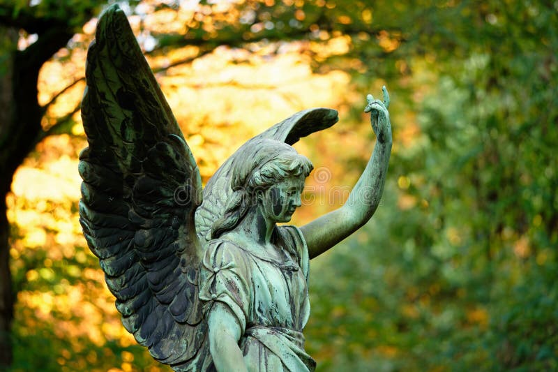 Angel in a Cemetery in Front of Luminous Autumn Leaves Stock Image ...