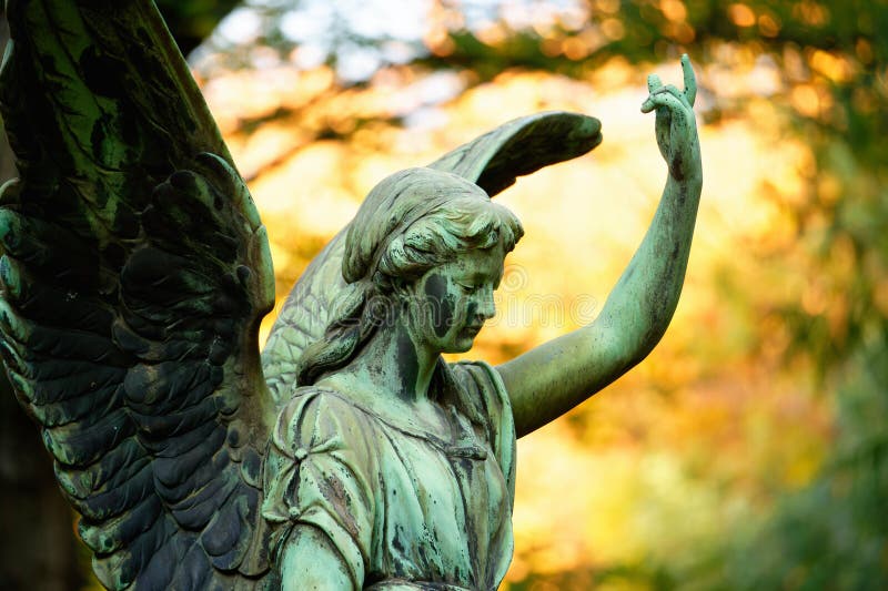 Angel in a Cemetery in Front of Luminous Autumn Leaves Stock Photo ...