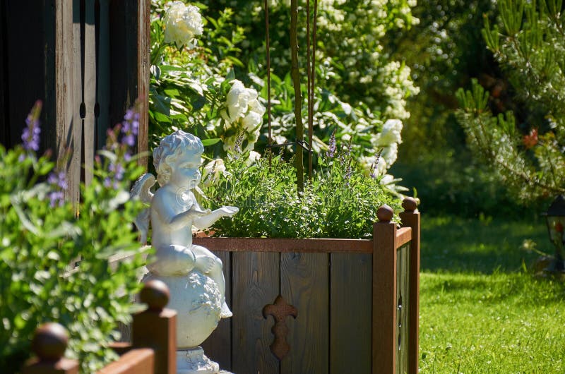 Angel Decoration in the Garden between Two Stylish Planters Stock Photo ...