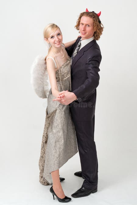 Angel and devil dancing stock image. Image of girl, fashion - 12829993