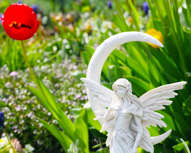 Angel before flowers stock photo. Image of commemorating - 36138062