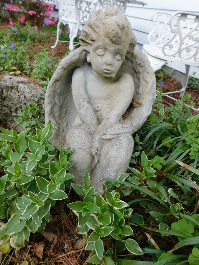 ANGEL in the GARDEN stock image. Image of statue, flowers - 89228049