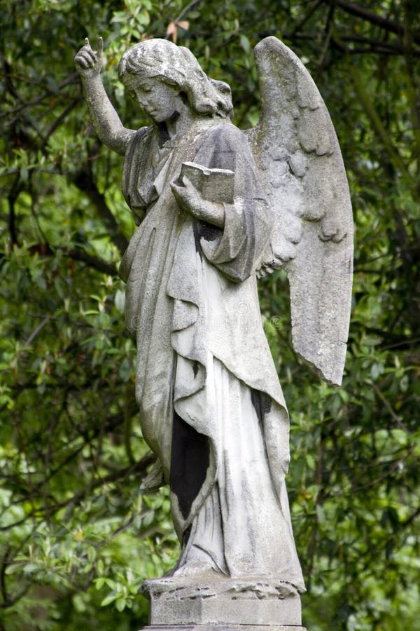 Angel with Hand Raised and Bible Stock Photo - Image of gardening ...