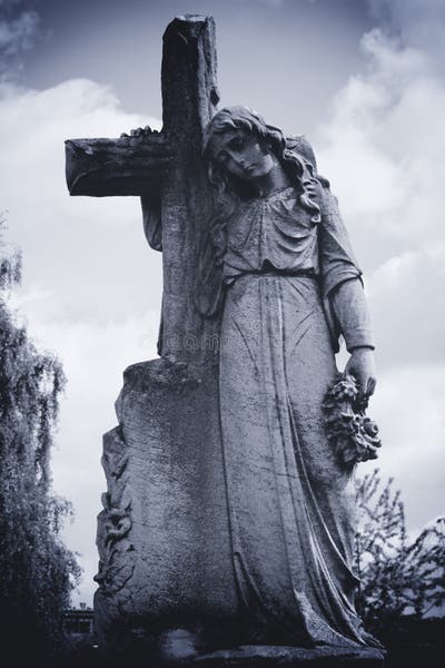 Angel leaning on cross stock photo. Image of historical - 32025728