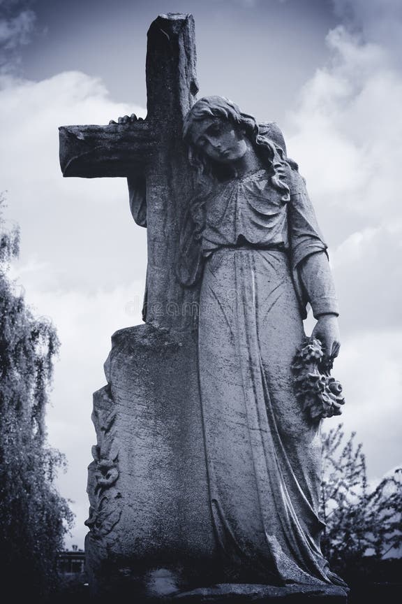Angel leaning on cross stock photo. Image of historical - 32025728