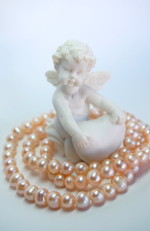 Angel and pearl collar stock photo. Image of fashion - 11226074