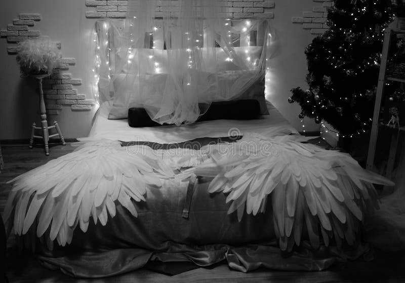 Angel`s Wings Lie on the Bed in Black and White Colors Stock Image ...