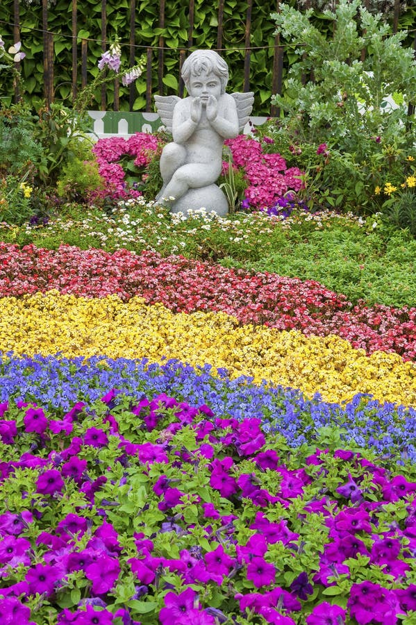 Angel sculpture in garden stock image. Image of beauty - 72520161