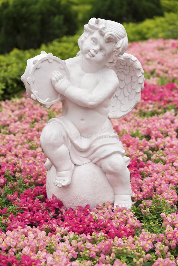 Angel sculpture in garden stock image. Image of garden - 75130103