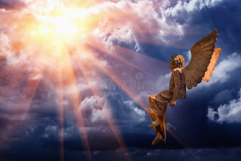 An Angel Sits on the Clouds in the Rays of the Sun. Copy Space Stock ...