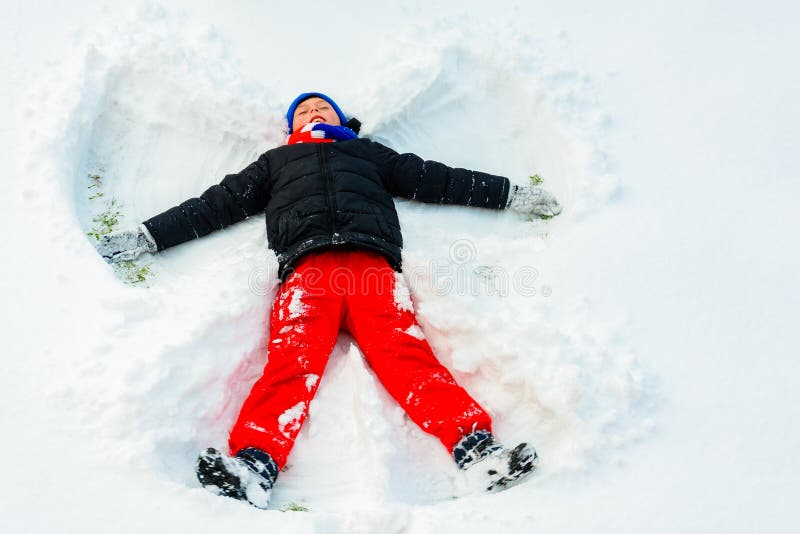 An Angel in the Snow Made by a Boy Stock Image - Image of daylight ...