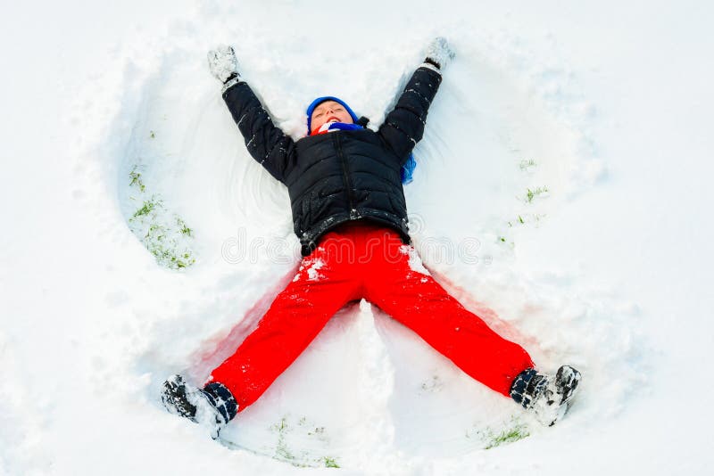 An Angel in the Snow Made by a Boy Stock Photo - Image of childhood ...