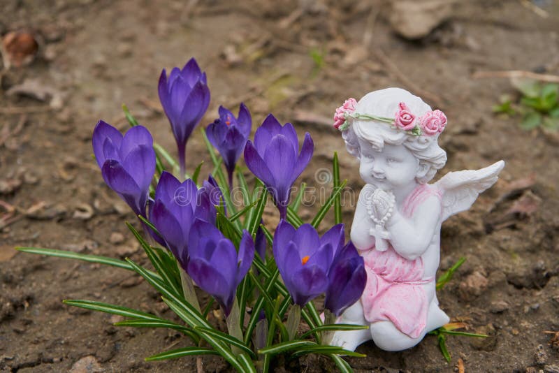 Angel with Spring Flowers, Figurine of an Angel on a Grave with Crocus ...