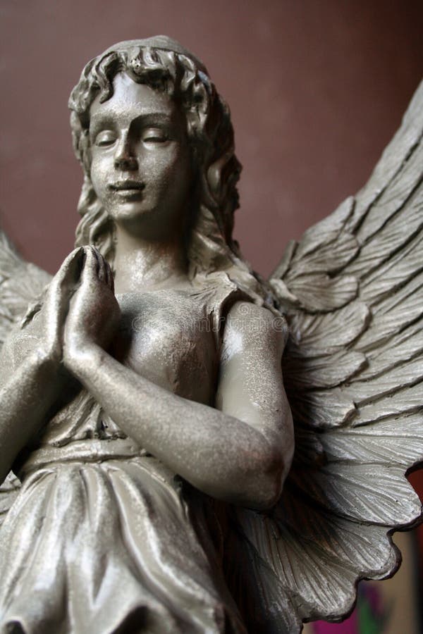 Angel statue in a cemetery stock photo. Image of praying - 19634190