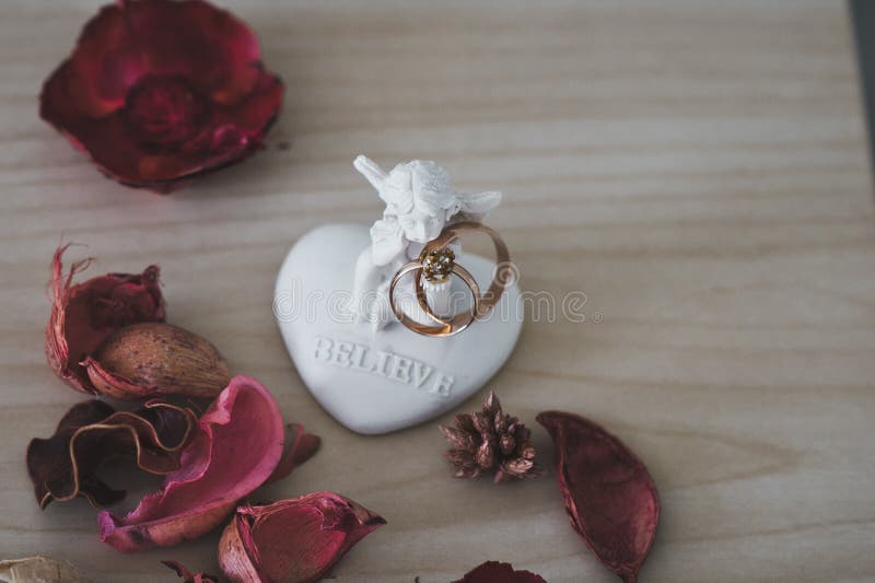 Angel and wedding rings. stock photo. Image of statue - 74964664