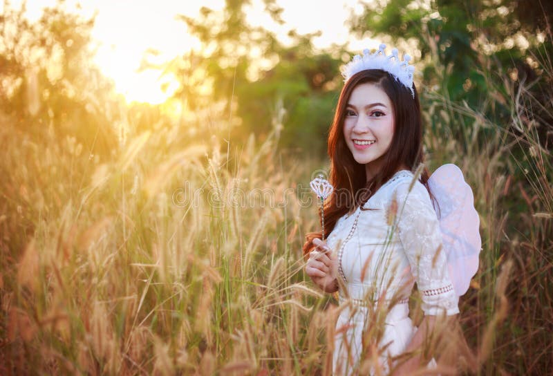 Angel Woman in a Grass Field with Sunlight Stock Photo - Image of ...