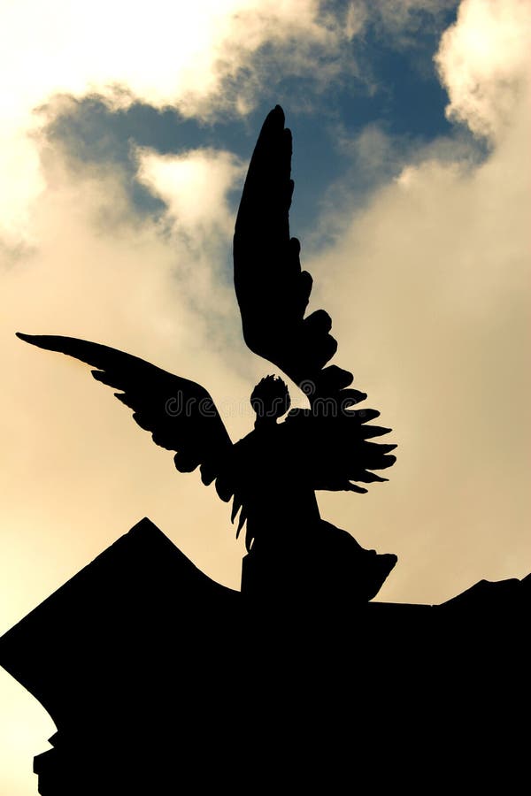 Angelic Statue Against Troubled Sky Stock Photo - Image of angelic ...