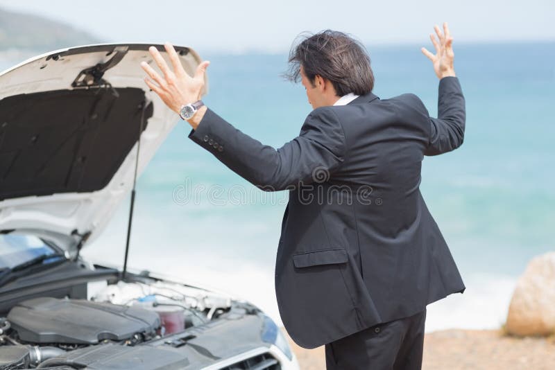 Angry Man Checking His Car Engine after Breaking Down Stock Photo ...