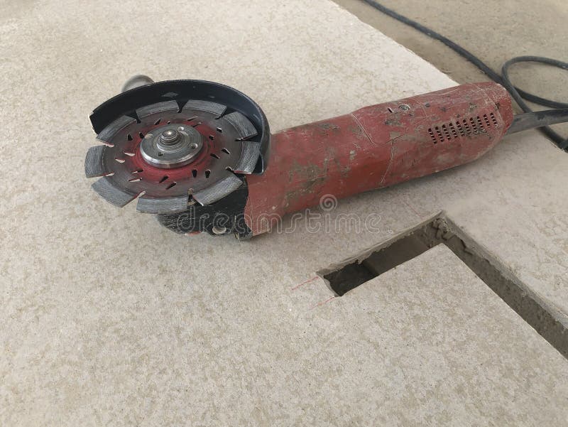 Angle Grinder and Cut Drywall Sheet. Hand Electric Power Tools Stock ...