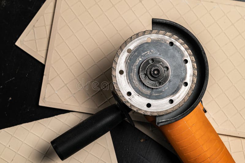 Angle Grinder Machine and Ceramic Tile on Black Work Table Stock Image ...