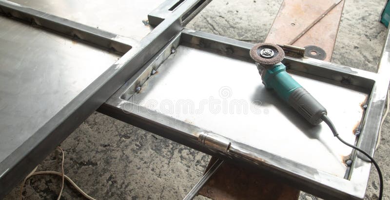 Angle Grinder Machine on Iron Gate. Metalworking Stock Photo - Image of ...